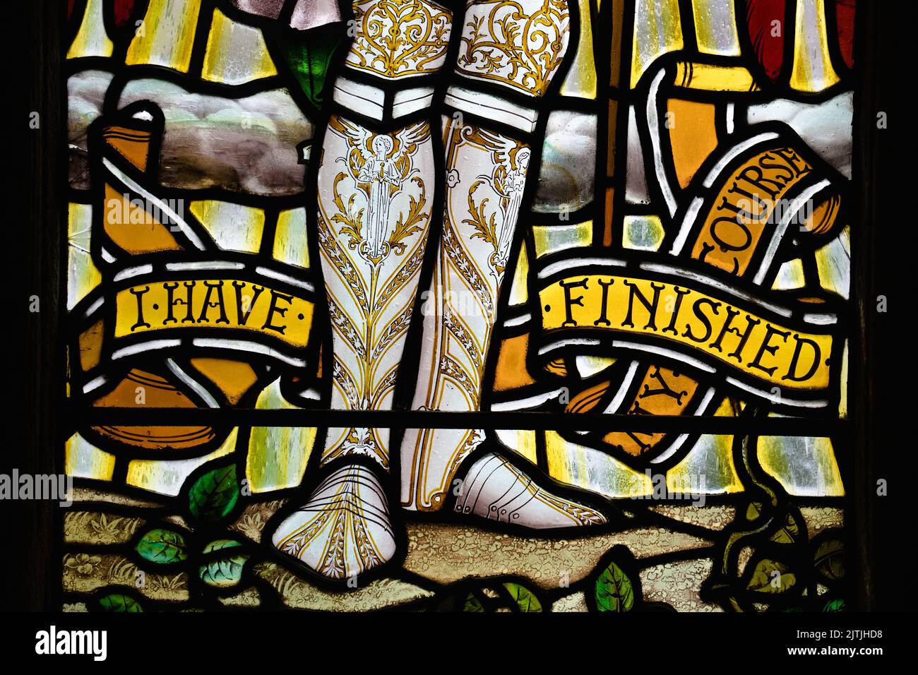 A stained glass window featuring scripture and knights, Scotland, UK ...