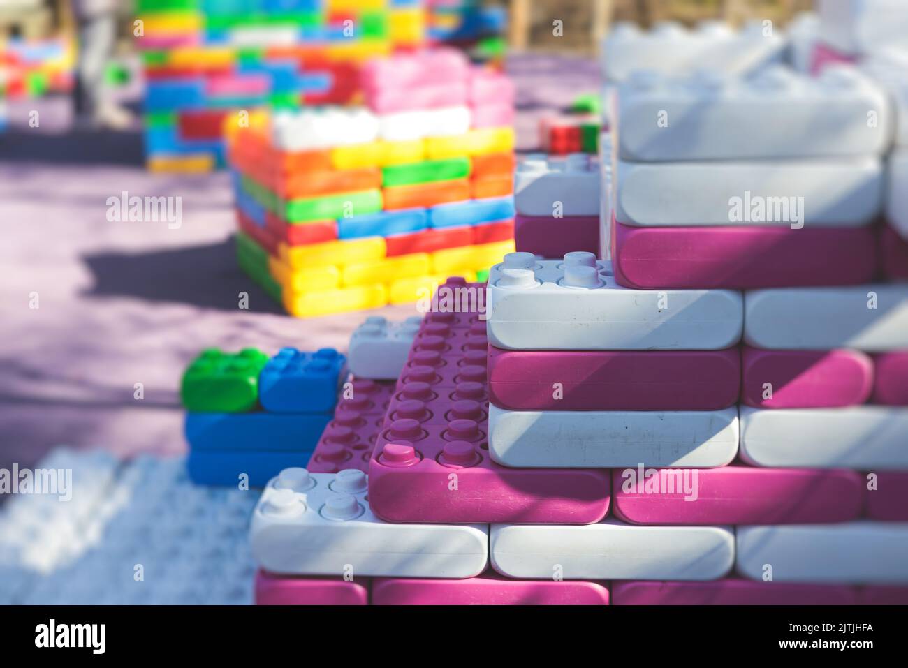 Children play colorful big toy blocks in kindergarten day care center ...