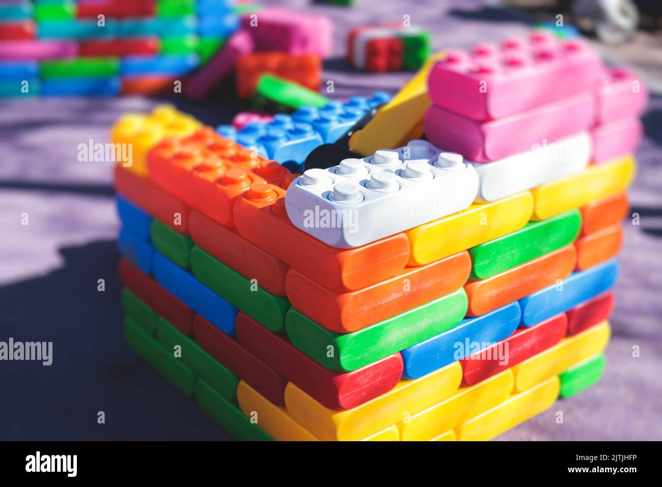 Children play colorful big toy blocks in kindergarten day care center ...