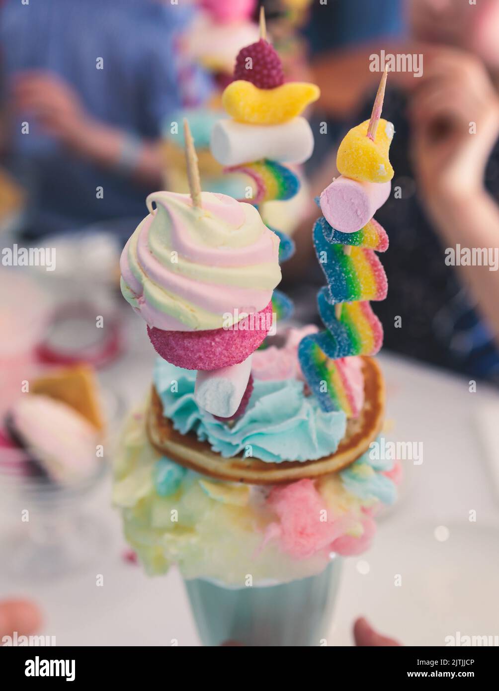 Glass pink milkshake decorated candy hi-res stock photography and ...