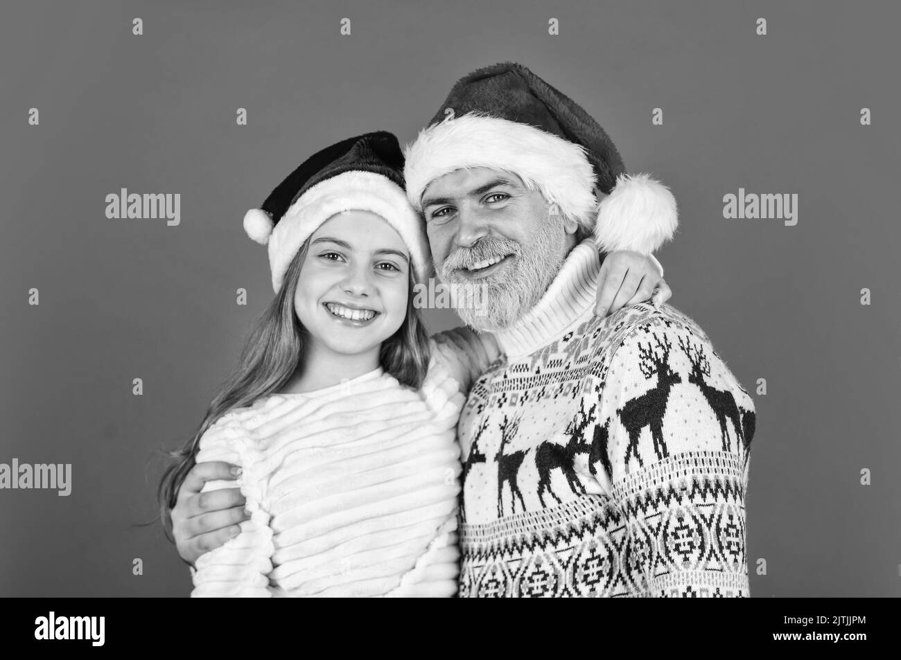 new year is here. bearded dad and small girl santa hat. funny knitted ...