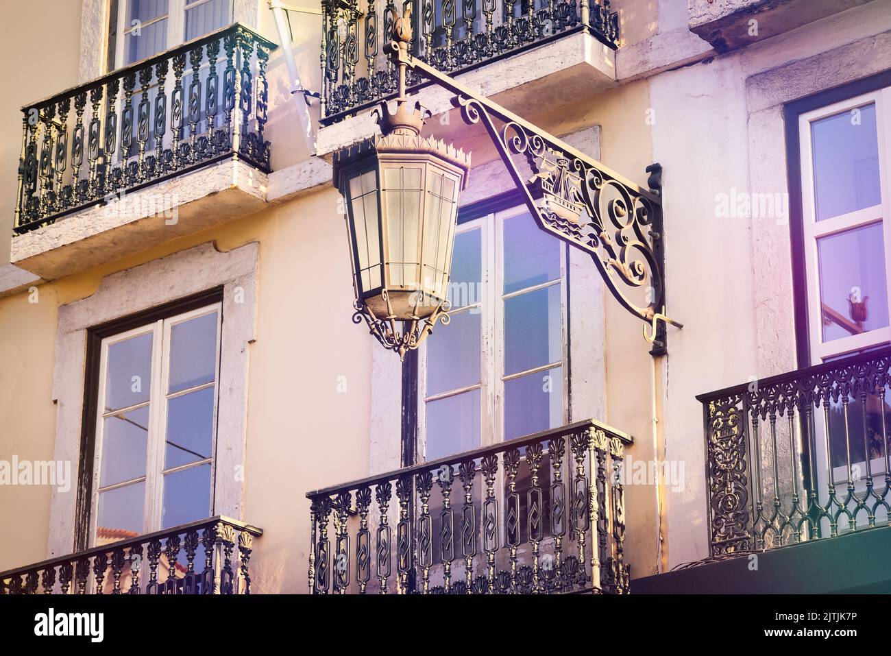 Vintage lantern and wrought iron balconies in Lisbon. Typical ...