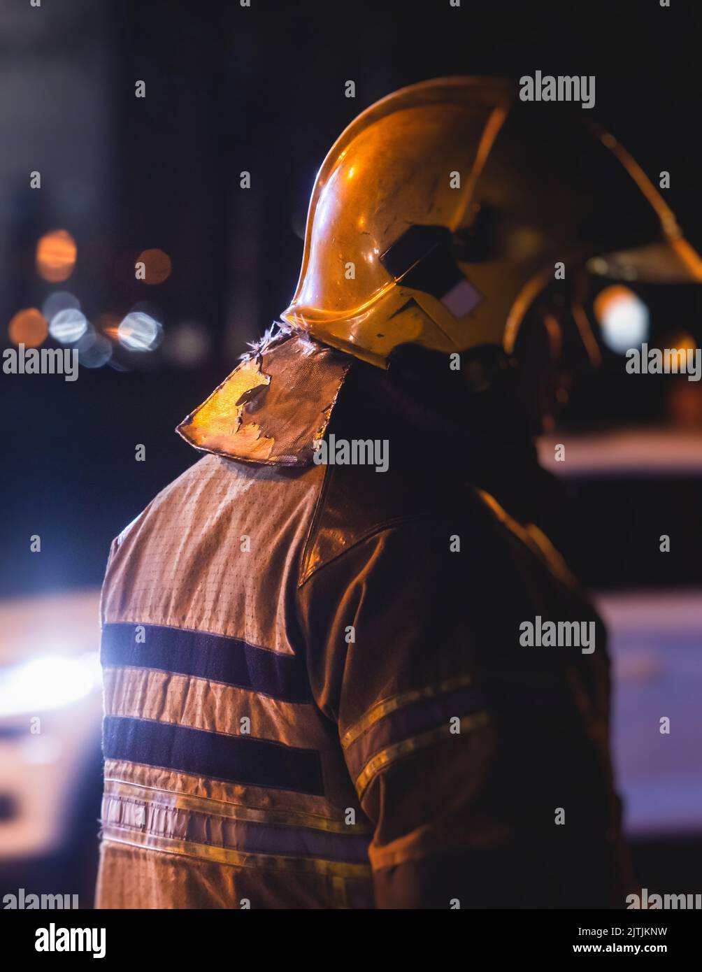 Group of fire men in uniform during fire fighting operation in the ...