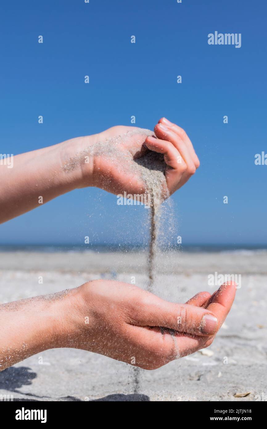 Human hands with falling water hi-res stock photography and images - Alamy