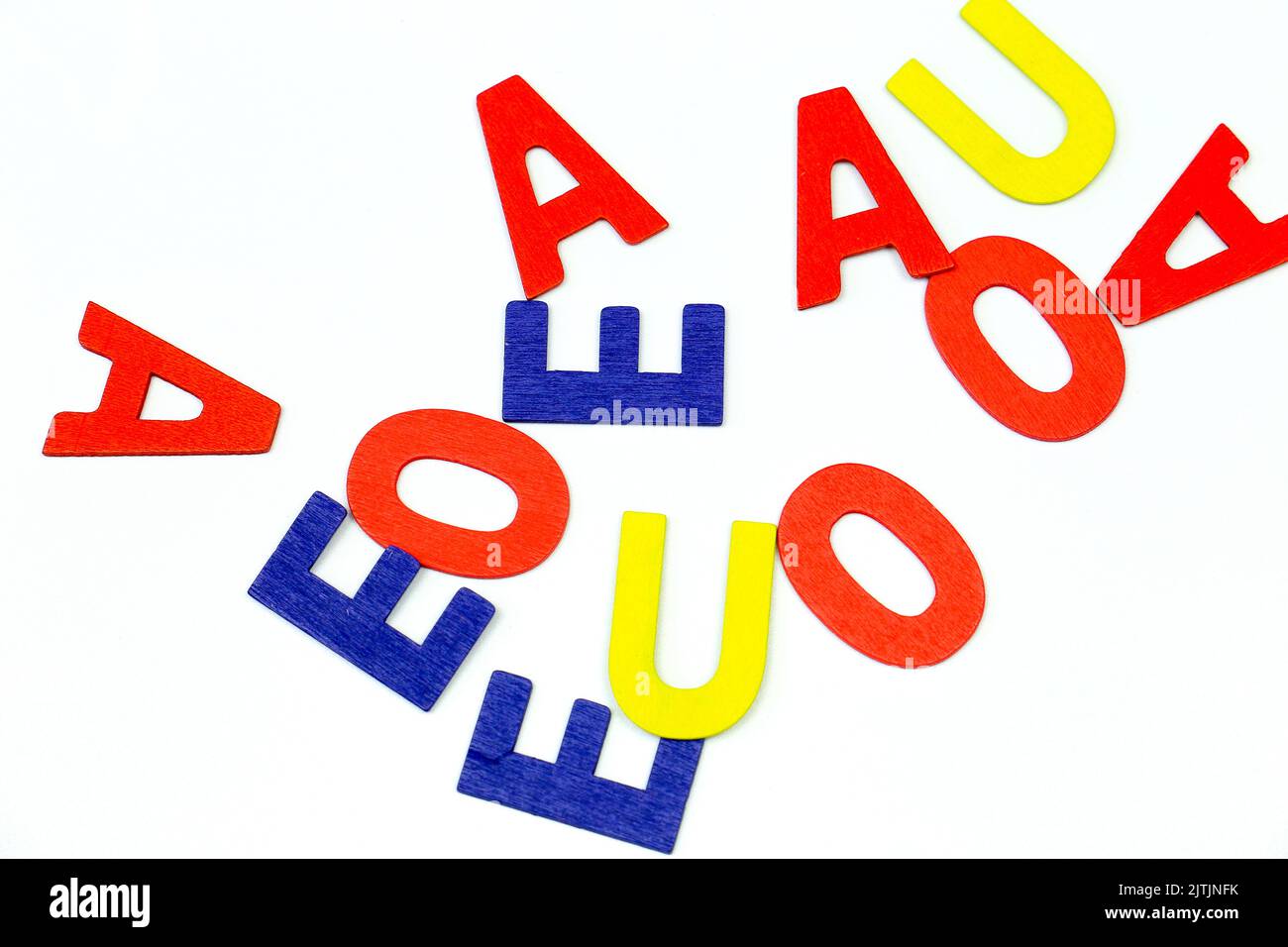 Many Multicolored vowels on white background Stock Photo - Alamy