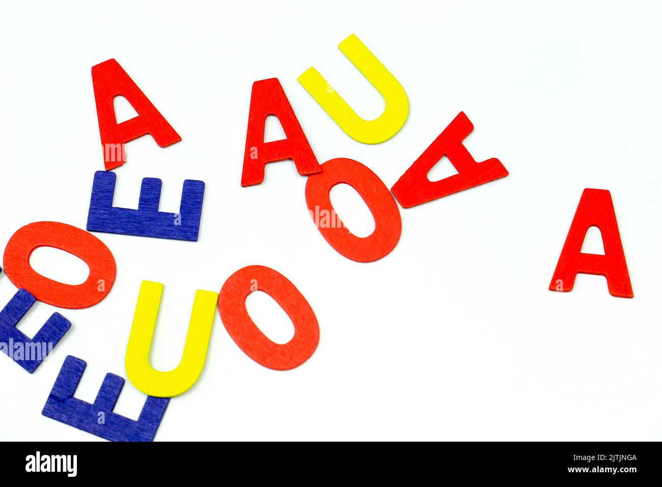 Many Multicolored vowels on white background Stock Photo - Alamy