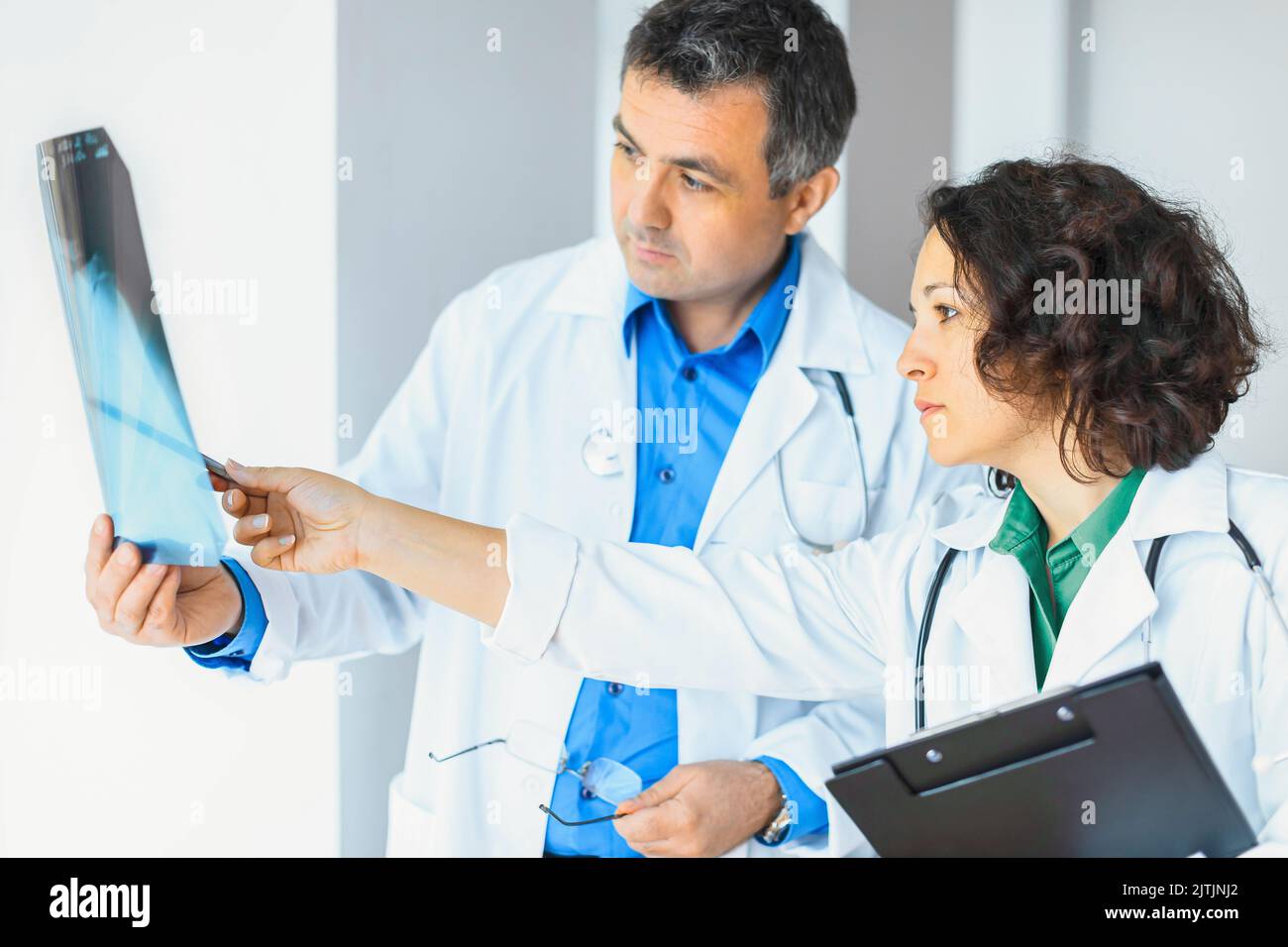 Doctor and nurse analysis x-ray image in hospital Stock Photo - Alamy