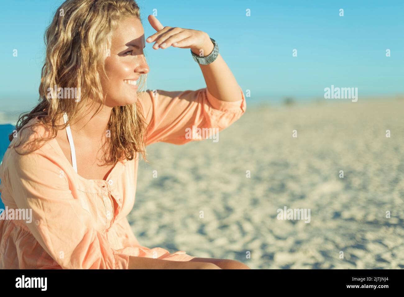 Happy blond traveller woman enjoys her beach vacation. Female Swedish ...