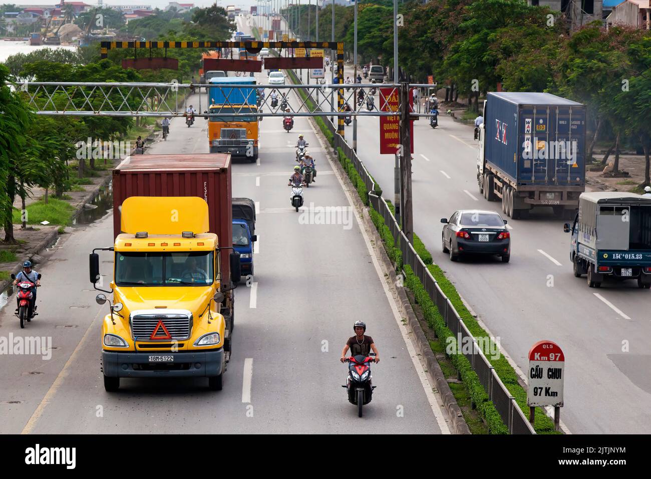 Commercial vehicles in traffic leaving Hai Phong port area, Vietnam ...