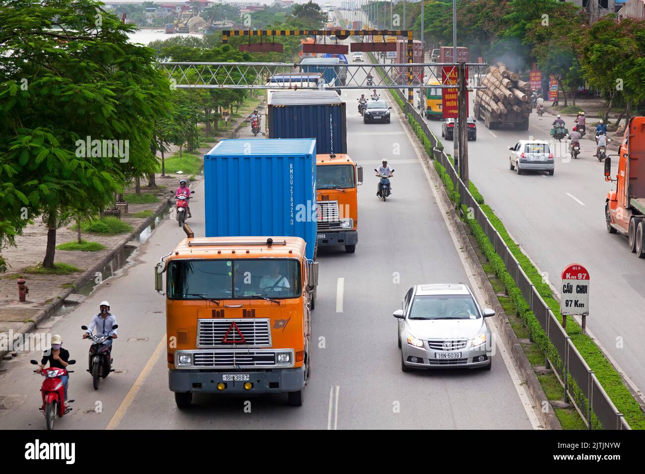 Commercial vehicles in traffic leaving Hai Phong port area, Vietnam ...