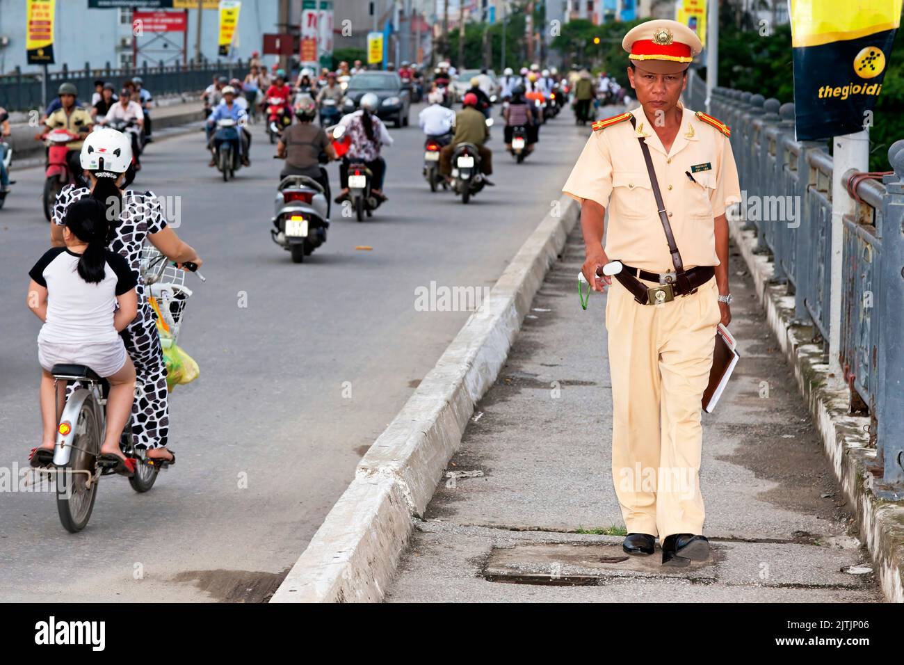 Vietnamese traffic police officer walking in the street, Hai Phong ...