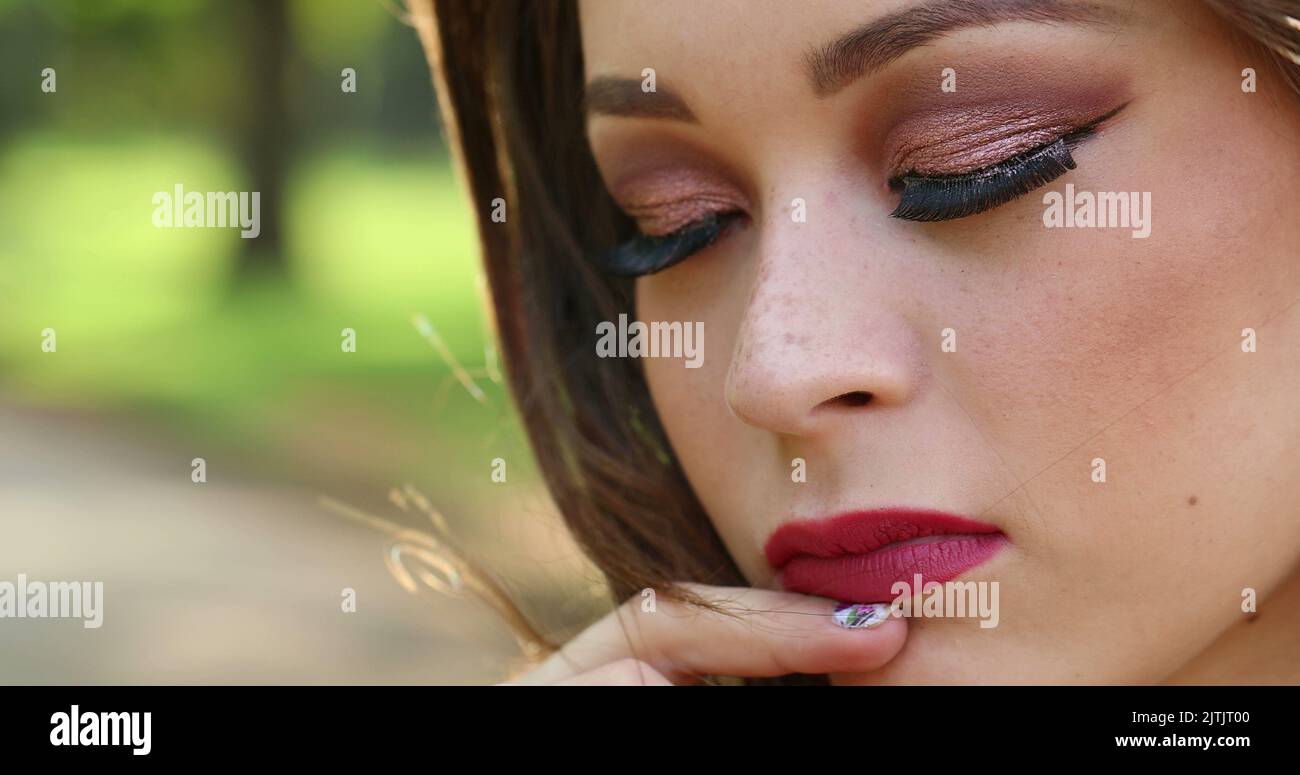 Young woman face closing eyes in meditation and contemplation ...