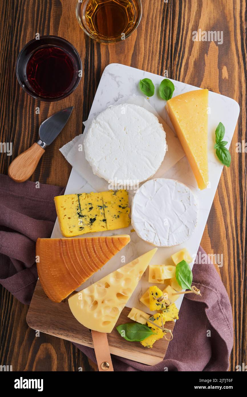 Set or assortment cheeses. Maasdam, smoked cheese, camembert, blue ...
