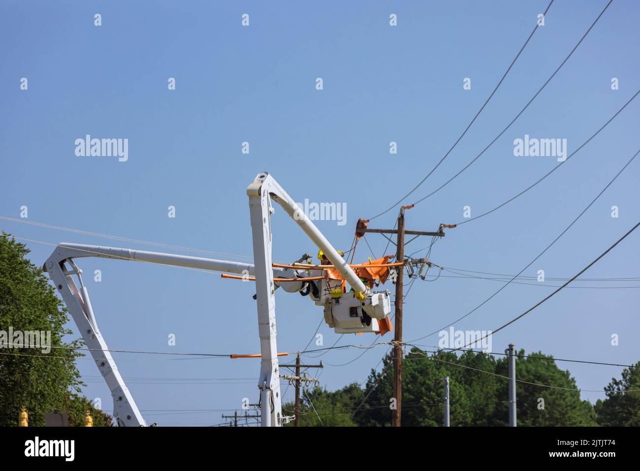 As a result of the storm, electrical workers are working in the ...