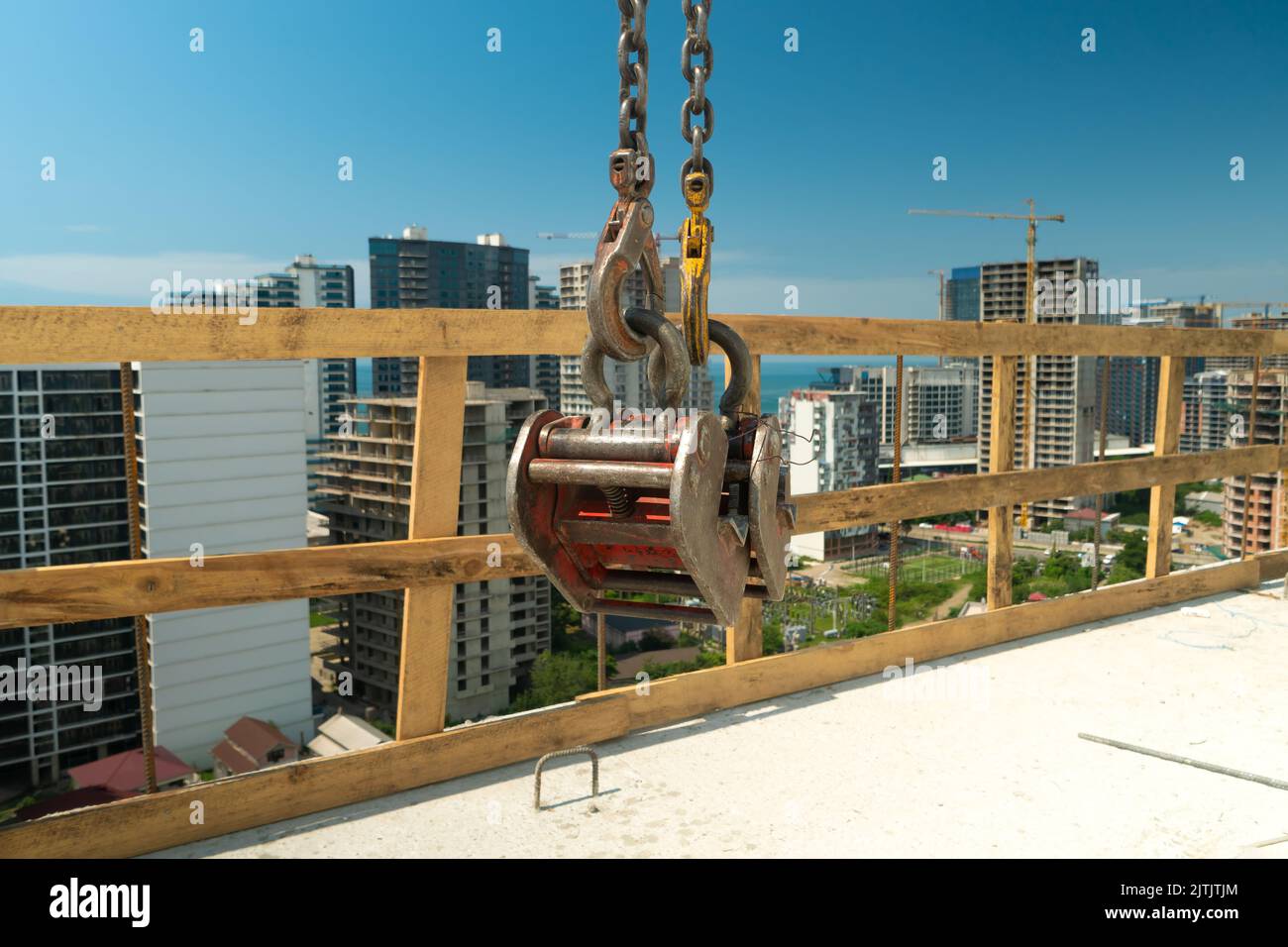 Close-up of a construction crane mounting grab on a construction site ...
