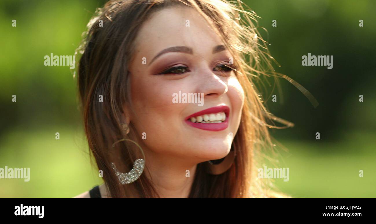 Woman spontaneous smile and laugh in outdoors. Authentic real life girl ...
