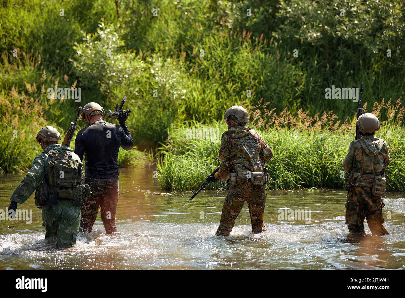 Special forces soldier with weapon take part in military maneuver. War ...