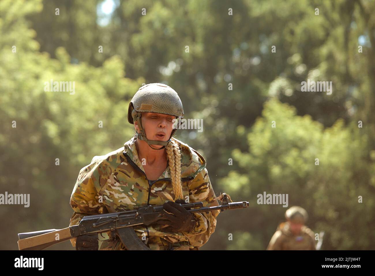 Caucasian Military lady woman in tactical gear posing for photo at ...
