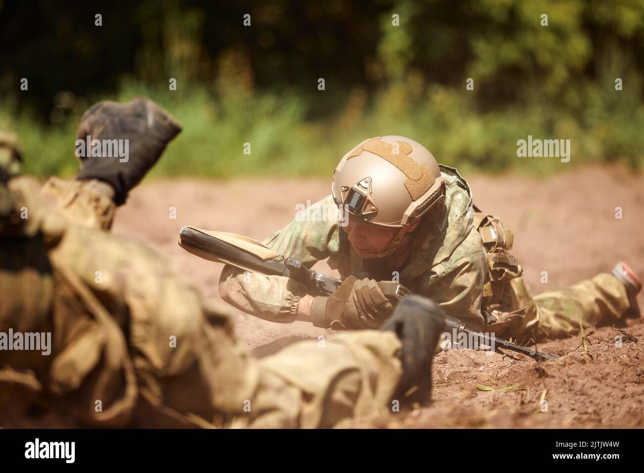 Special forces soldier with weapon take part in military maneuver. War ...