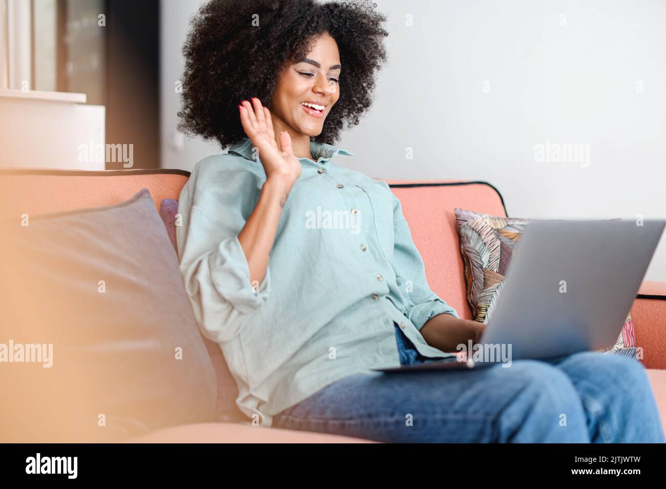 Video conference. Smiling young african american woman using laptop for ...