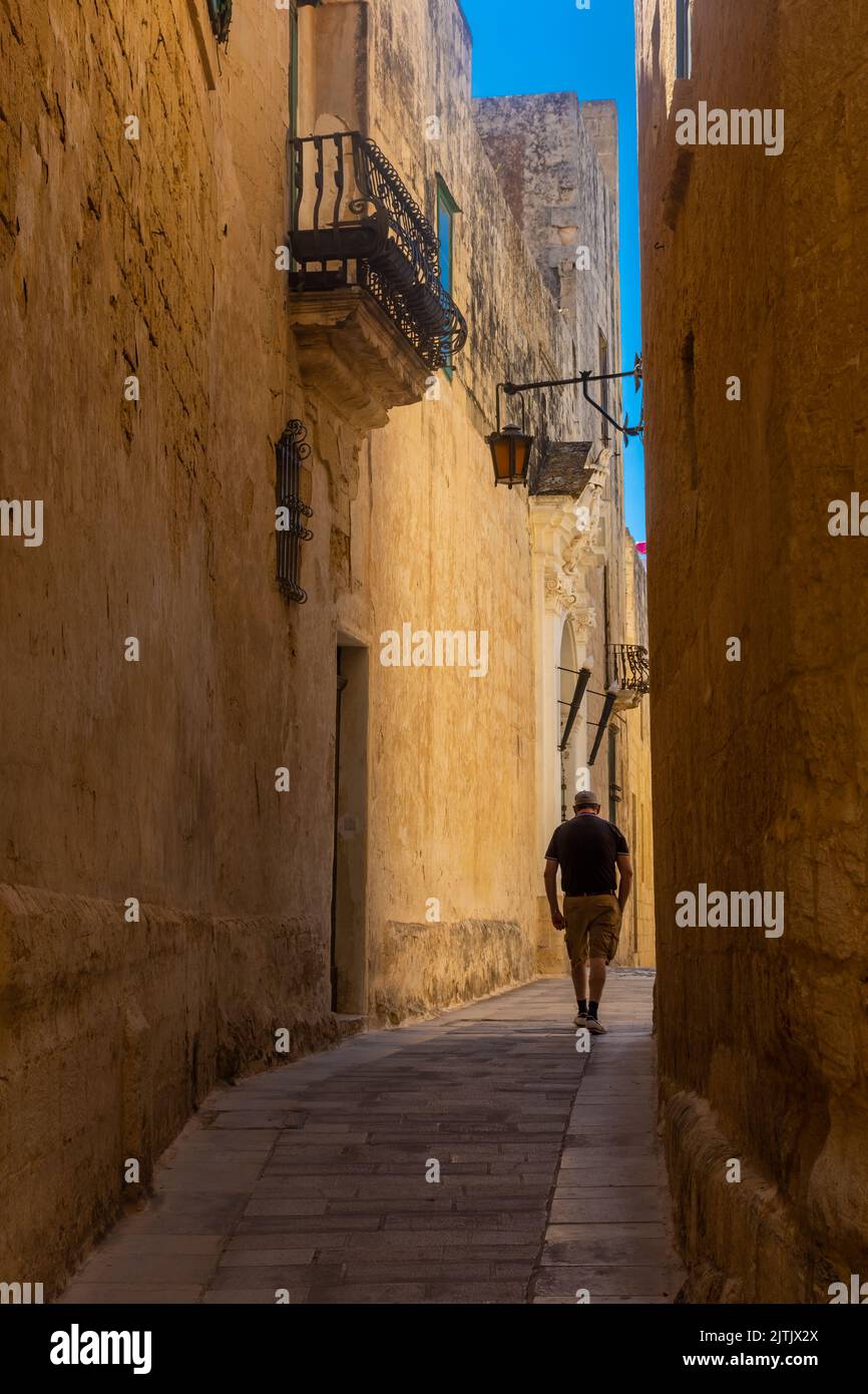 Mdina, Malta, 21 May 2022: Old man walking the streets of the ancient ...