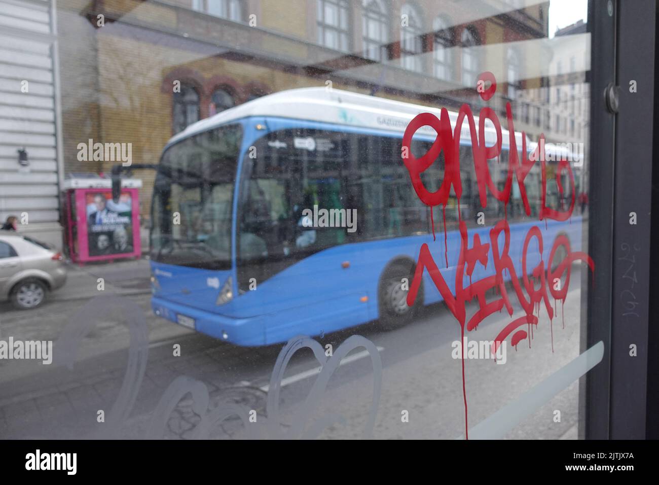 Bus through a graffiti window Stock Photo - Alamy