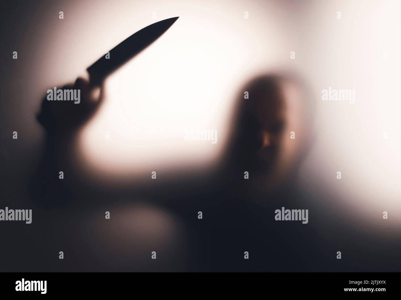 Horror, halloween background - Shadowy figure behind glass holding a ...