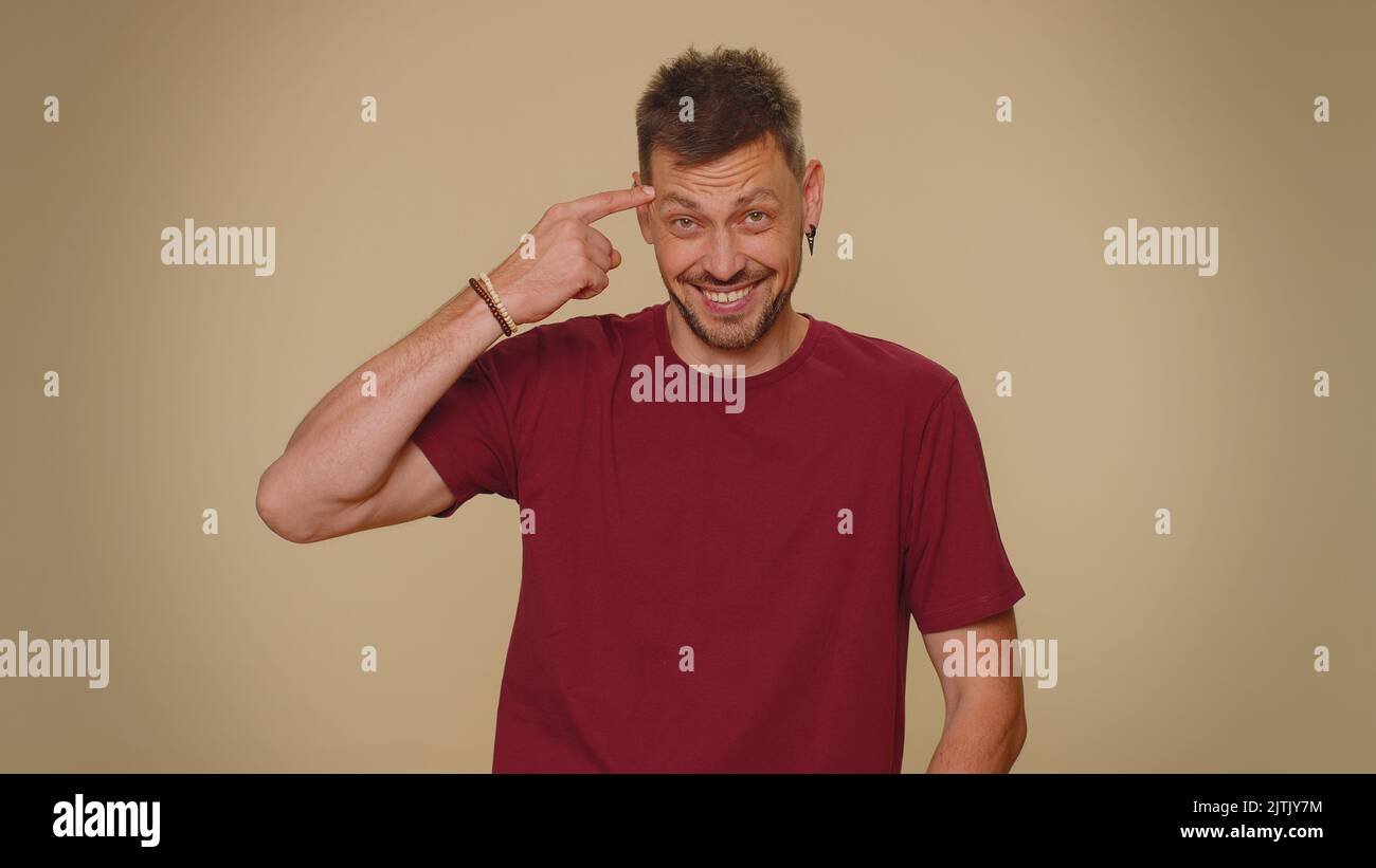 You are crazy, out of mind. Bearded handsome young man pointing at ...