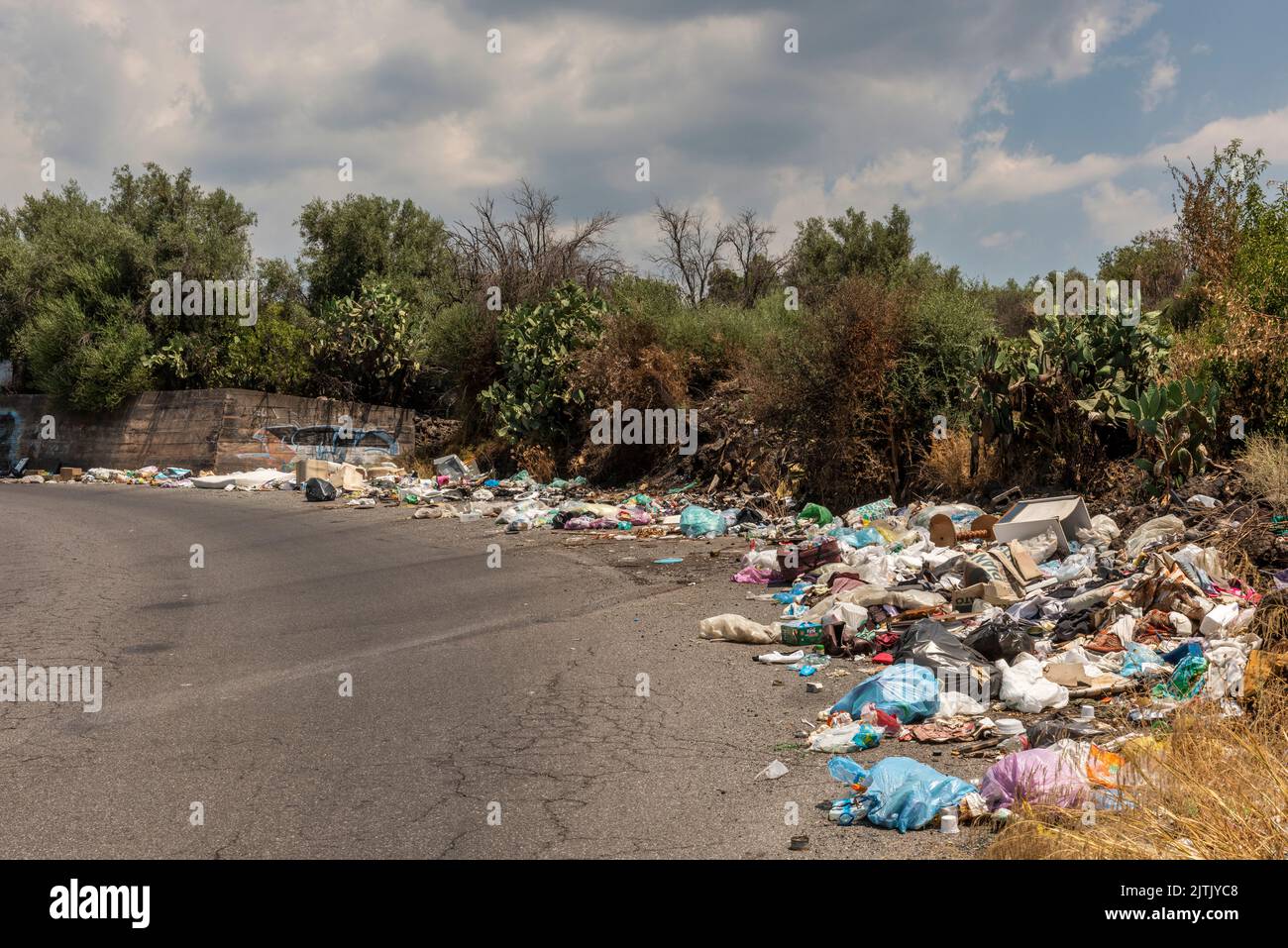 Heaps of domestic refuse dumped by the roadside on Mount Etna, Sicily ...
