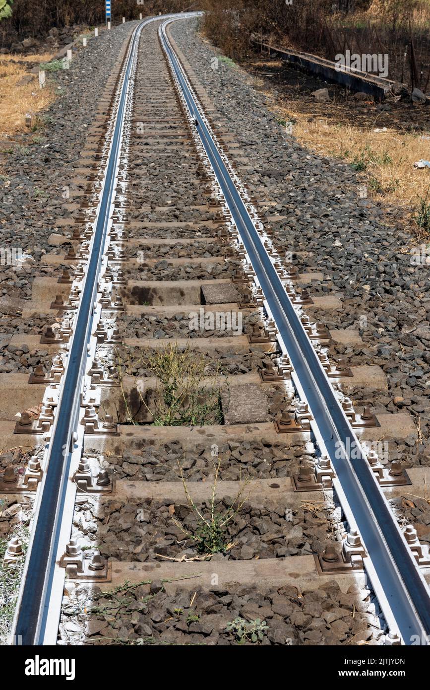 Railway tracks in Sicily, Italy, painted white to reflect sunlight and ...