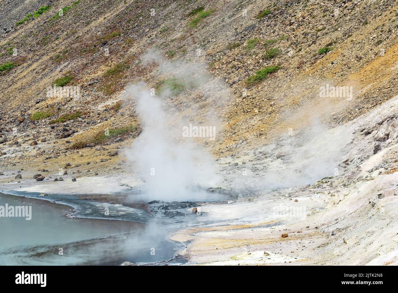 boiling fumaroles and sulfur deposits at the hydrothermal outlet on the ...