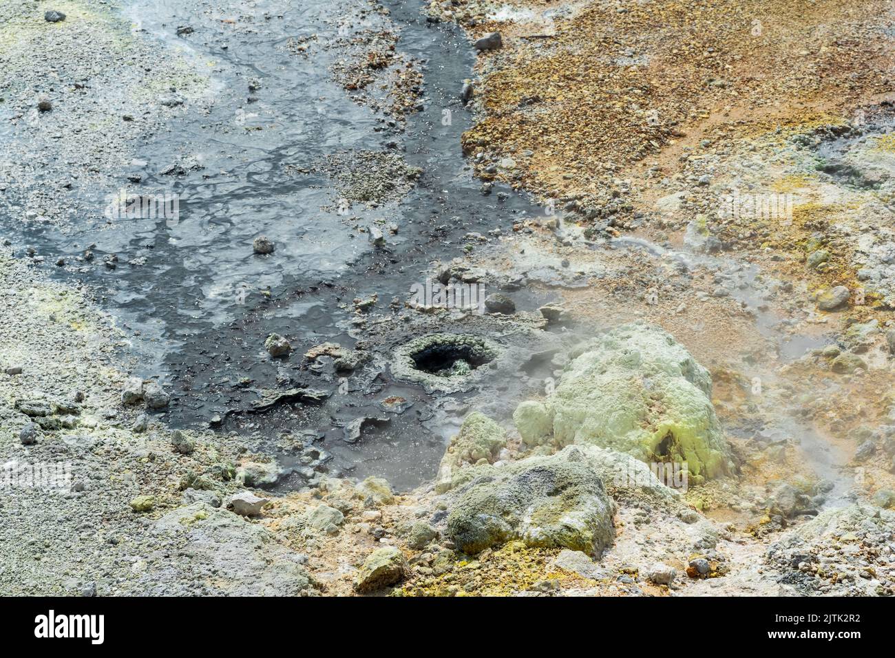 boiling fumaroles and sulfur deposits at the hydrothermal outlet on the ...