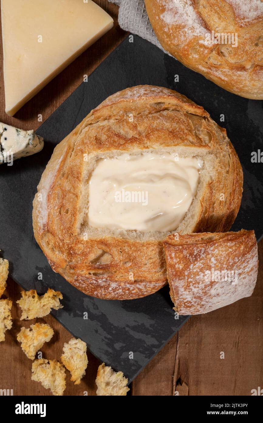 Cream cheese inside Italian bread with croutons, fondue Stock Photo - Alamy