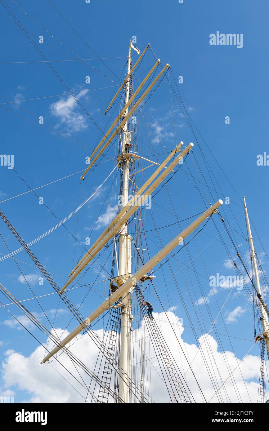 Person climbing on the mast and shrouds of the museum ship Rickmer ...