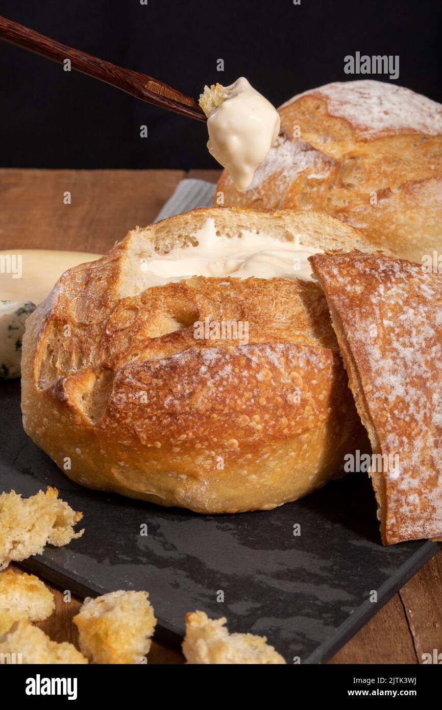 Cream cheese inside Italian bread with croutons, fondue Stock Photo - Alamy