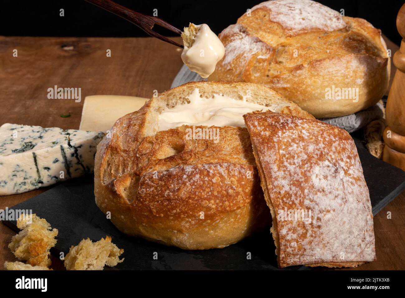Cream cheese inside Italian bread with croutons, fondue Stock Photo - Alamy