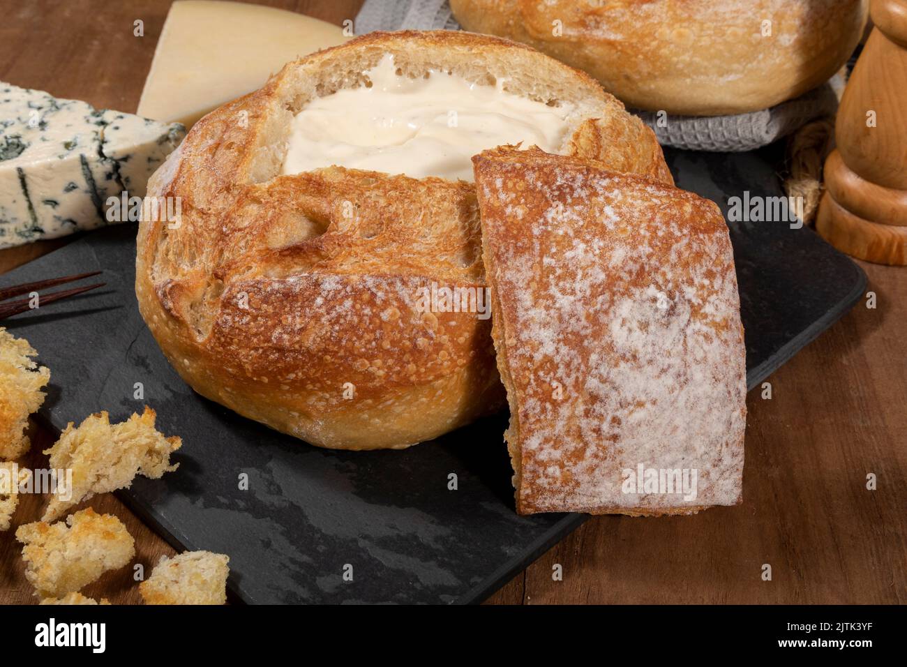 Cream cheese inside Italian bread with croutons, fondue Stock Photo - Alamy