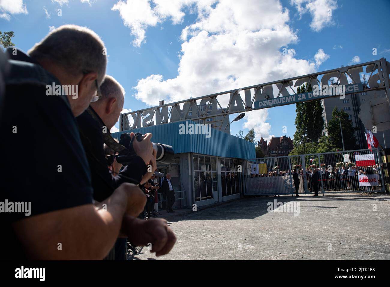 Photojournalists alert with their cameras await the opening of Gate 2 ...