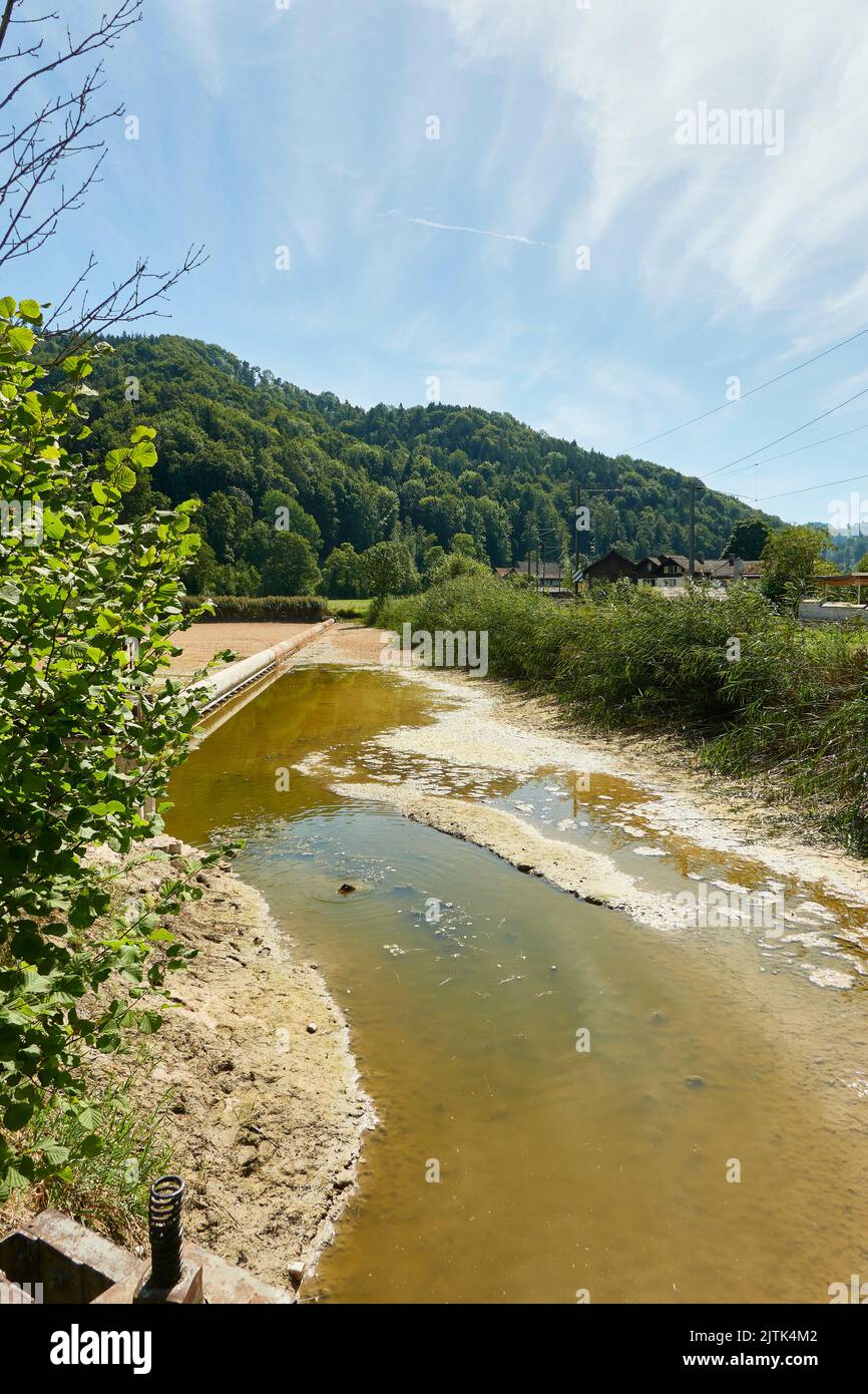 Dried Up Pond With Silty Water Residue And Water Pipe In Heat Summer ...