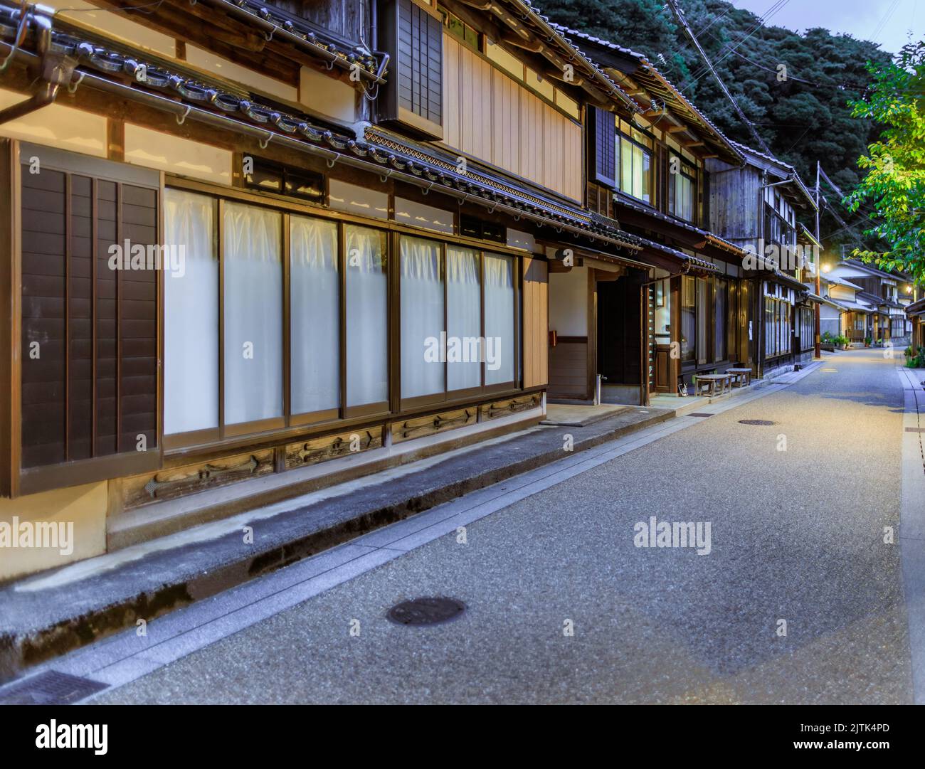 Large windows and traditional Japanese building along empty road at ...