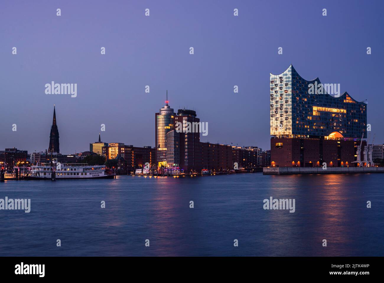 The Elbe Philharmonic Hall in Hamburg harbour glows in the golden hour ...