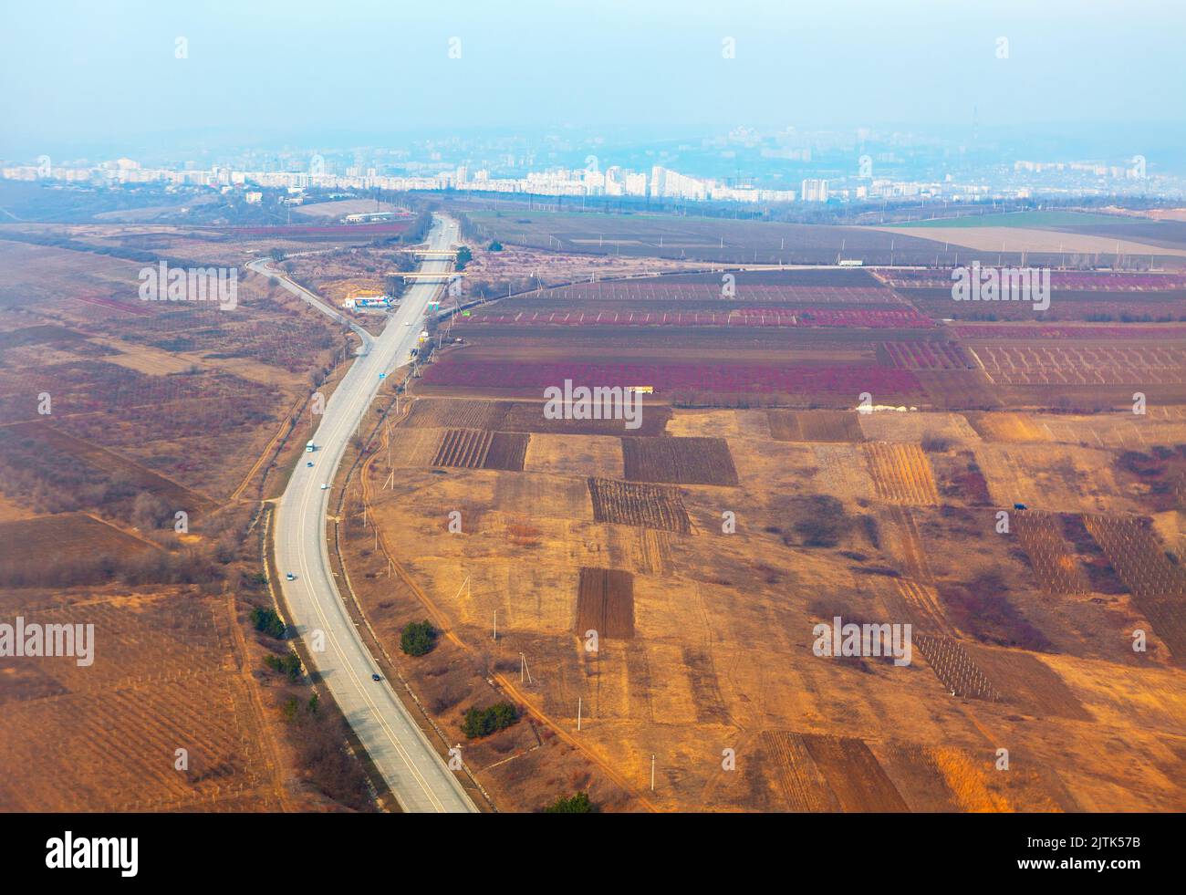 Aerial view of a highway going through fields . Chisinau suburb view ...