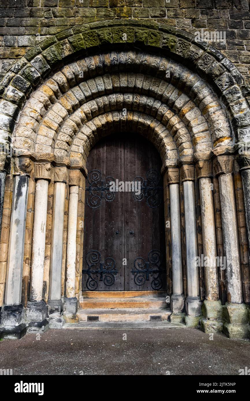 A vertical of an ancient wooden door of Dunfermline castle framed by ...
