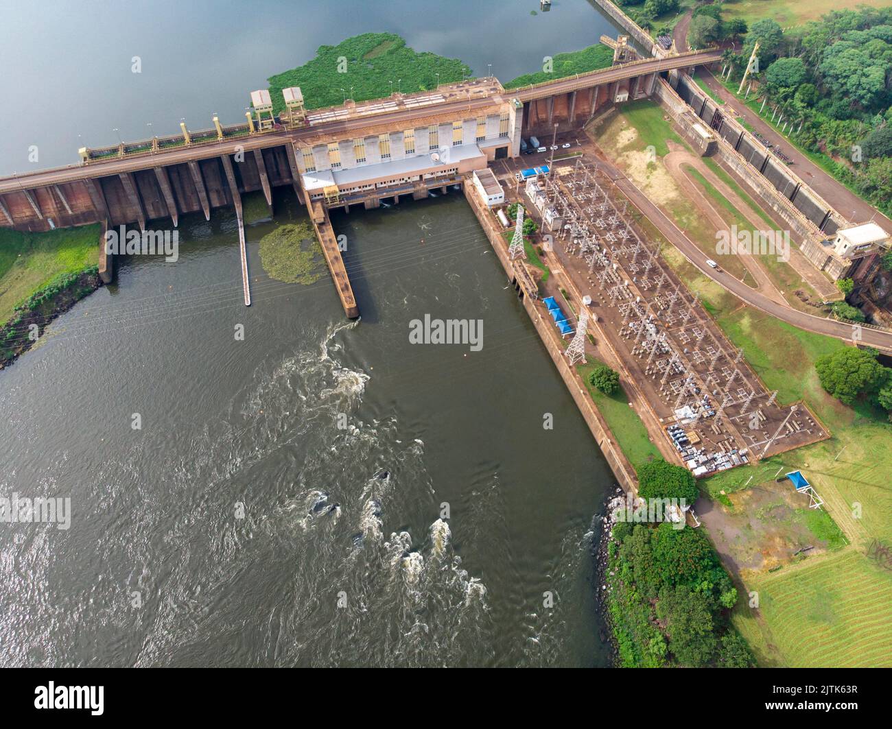 Aerial view of Dam at reservoir with flowing water, hydroelectricity ...