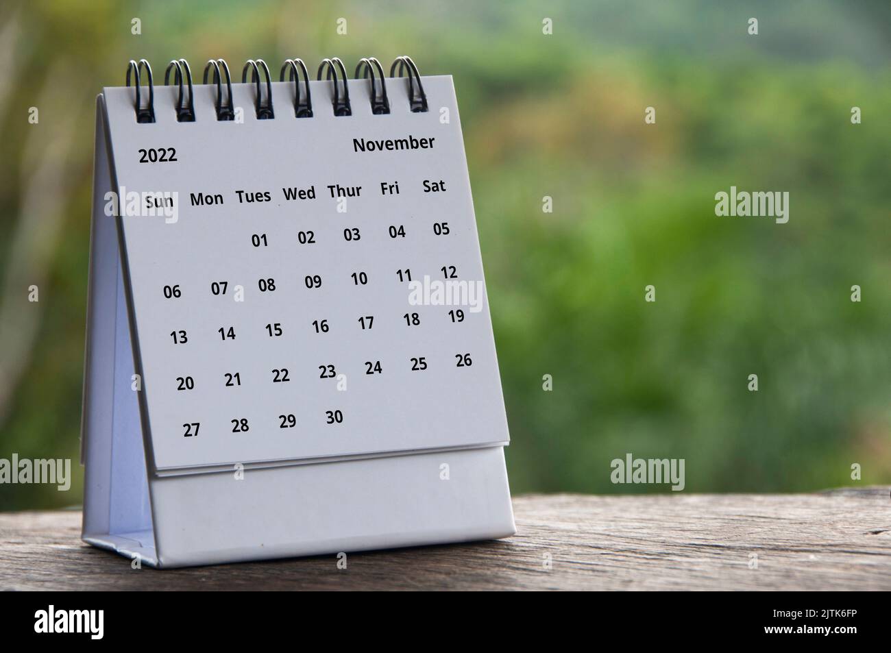 November month calendar with blurred nature background. Copy space ...