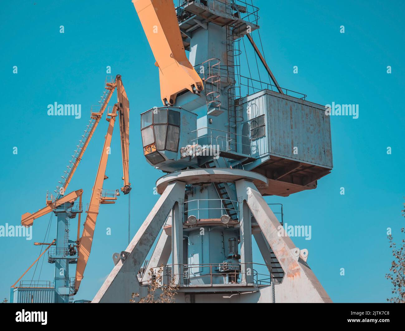 Port crane cabin close-up. Heavy port cranes in a cargo terminal ...