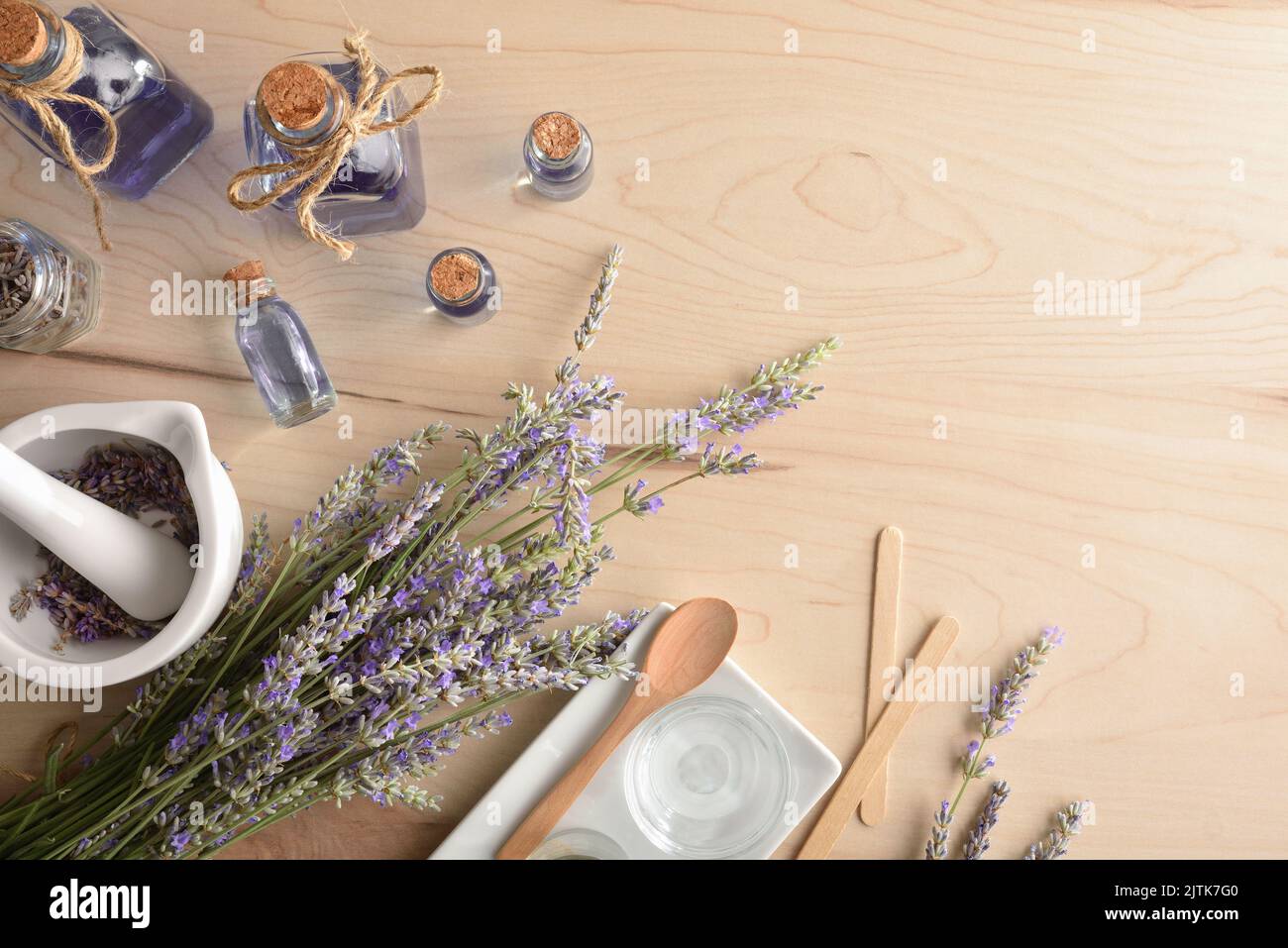 Homemade natural lavender essence with jars and spikes and tools for ...