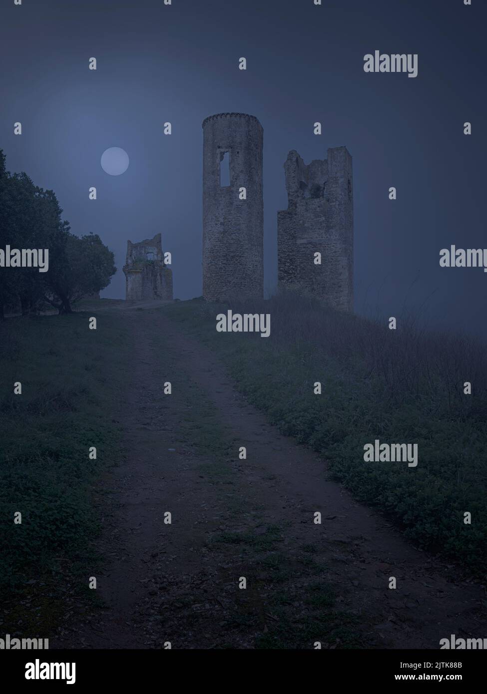 Dark and creepy old war ruin in a mysterious foggy full moon night ...