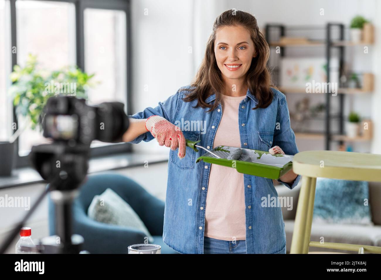 woman or blogger showing old chair renovation Stock Photo - Alamy