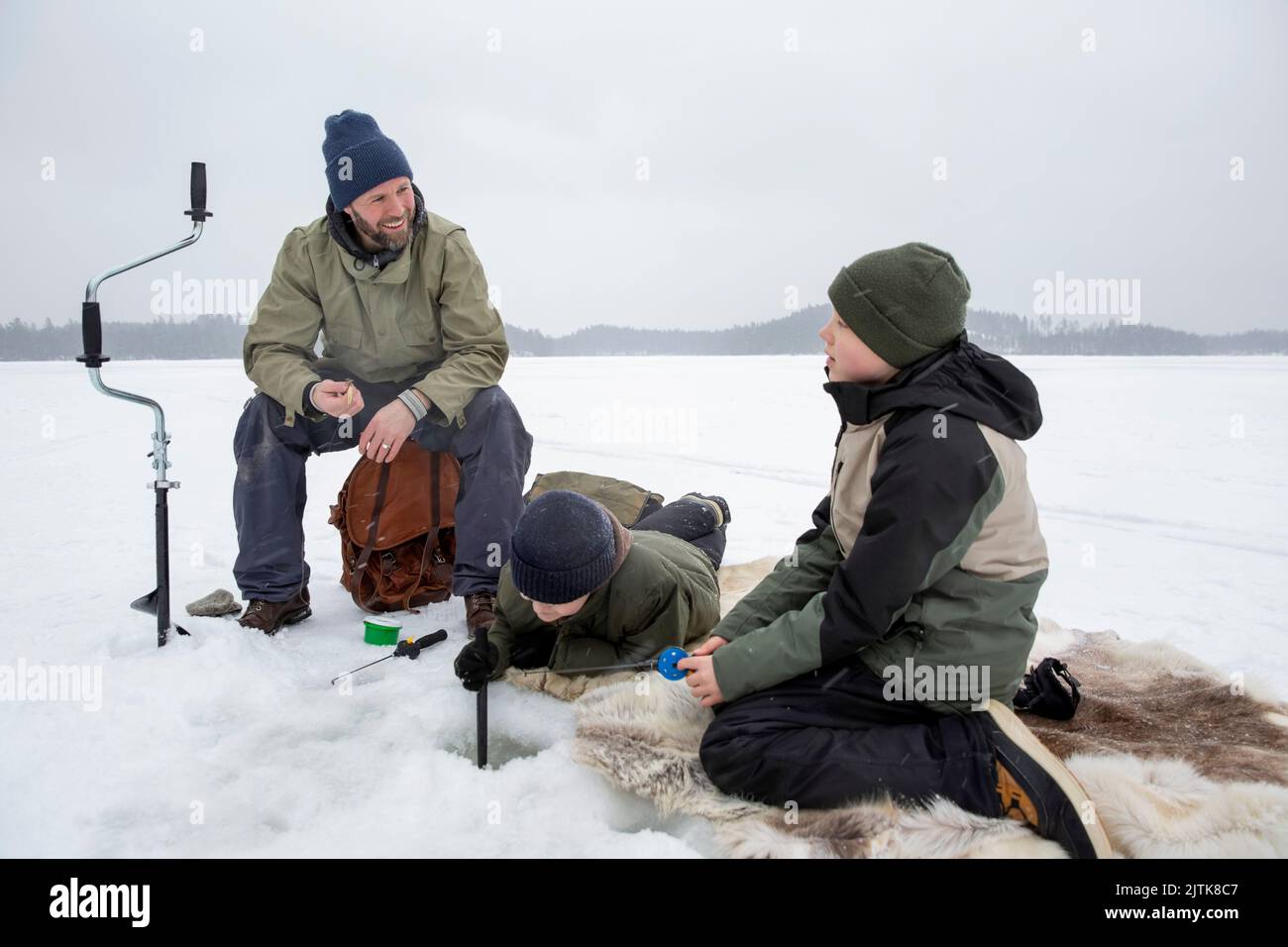 Man And Boy Ice Fishing